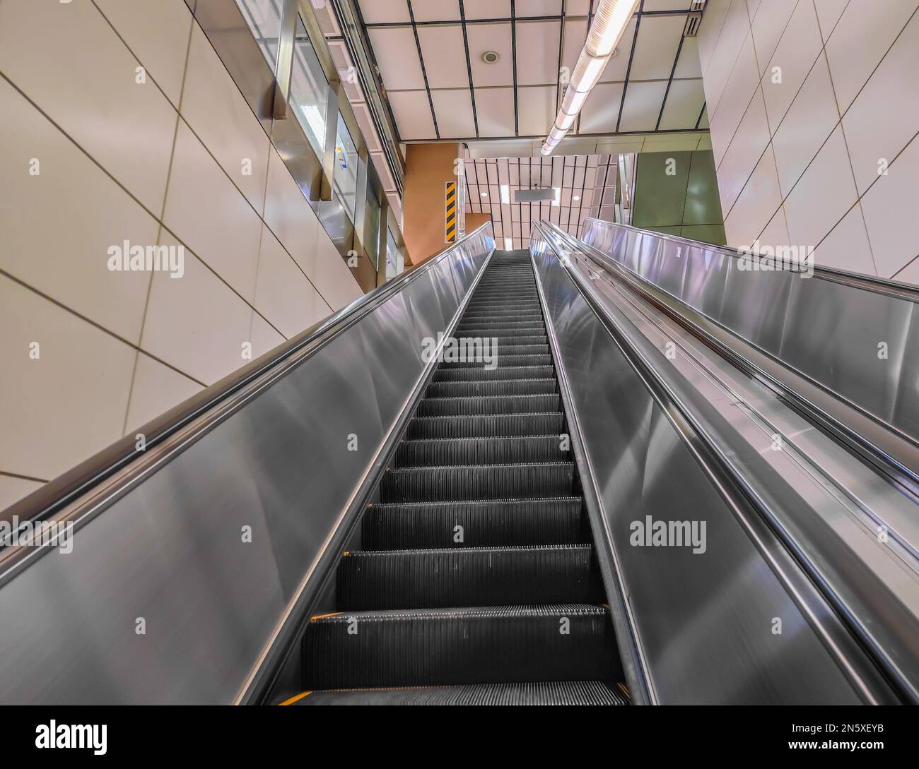 Photo of metro escalator stairs from below heading to exit Stock Photo ...