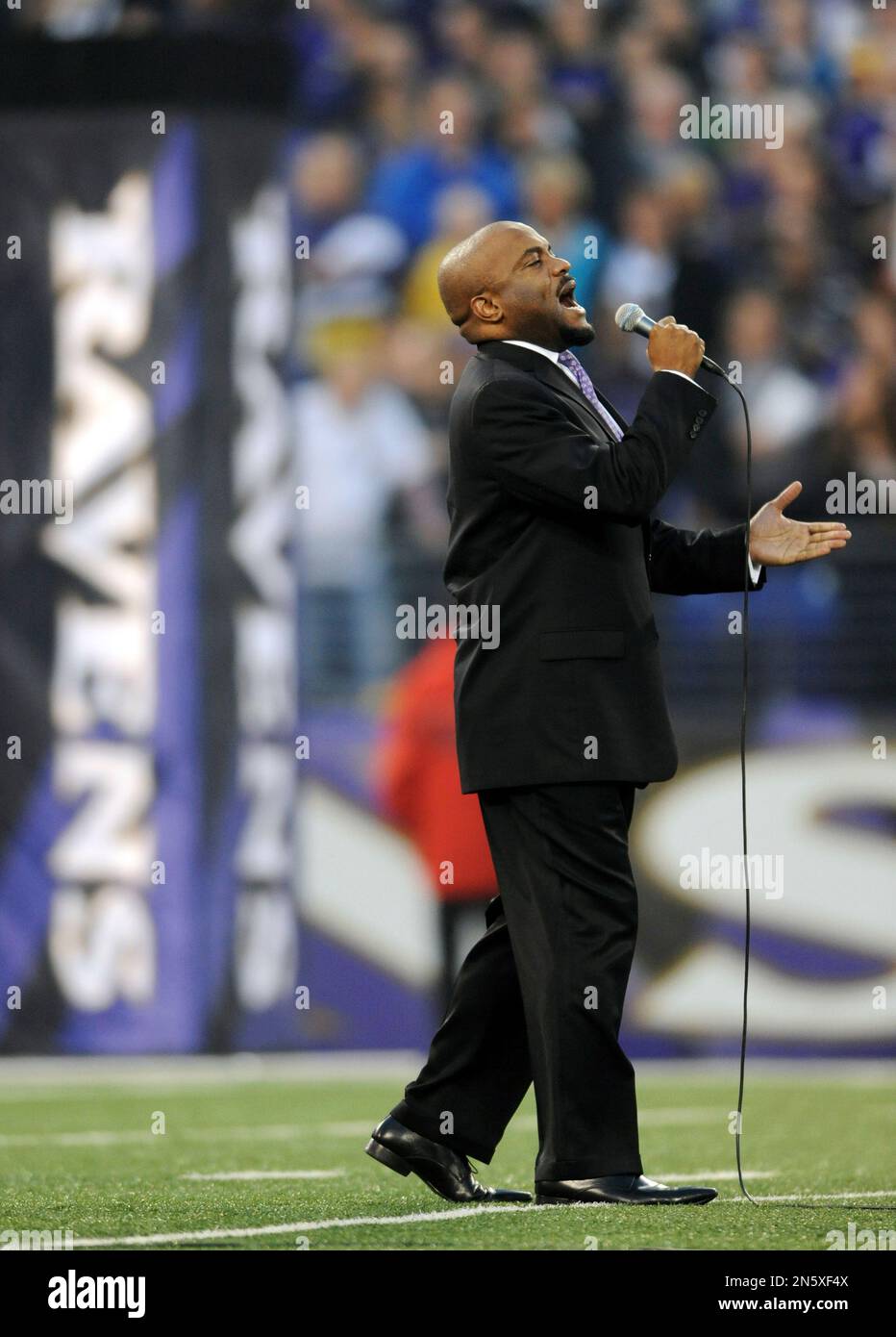 Mishael Miller performs the national anthem before an NFL football game ...