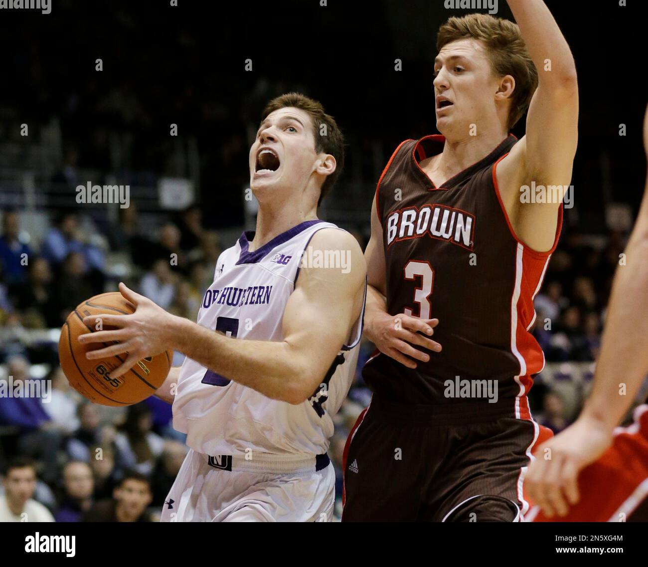 Northwestern guard Dave Sobolewski, left, drives to the basket against ...