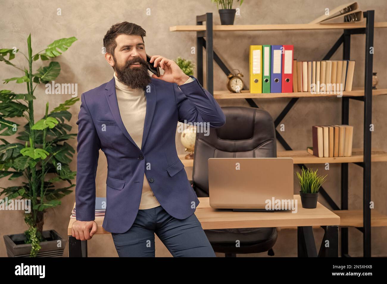 Reimagined mobile experience. Happy man talk on phone in office. Mobile ...