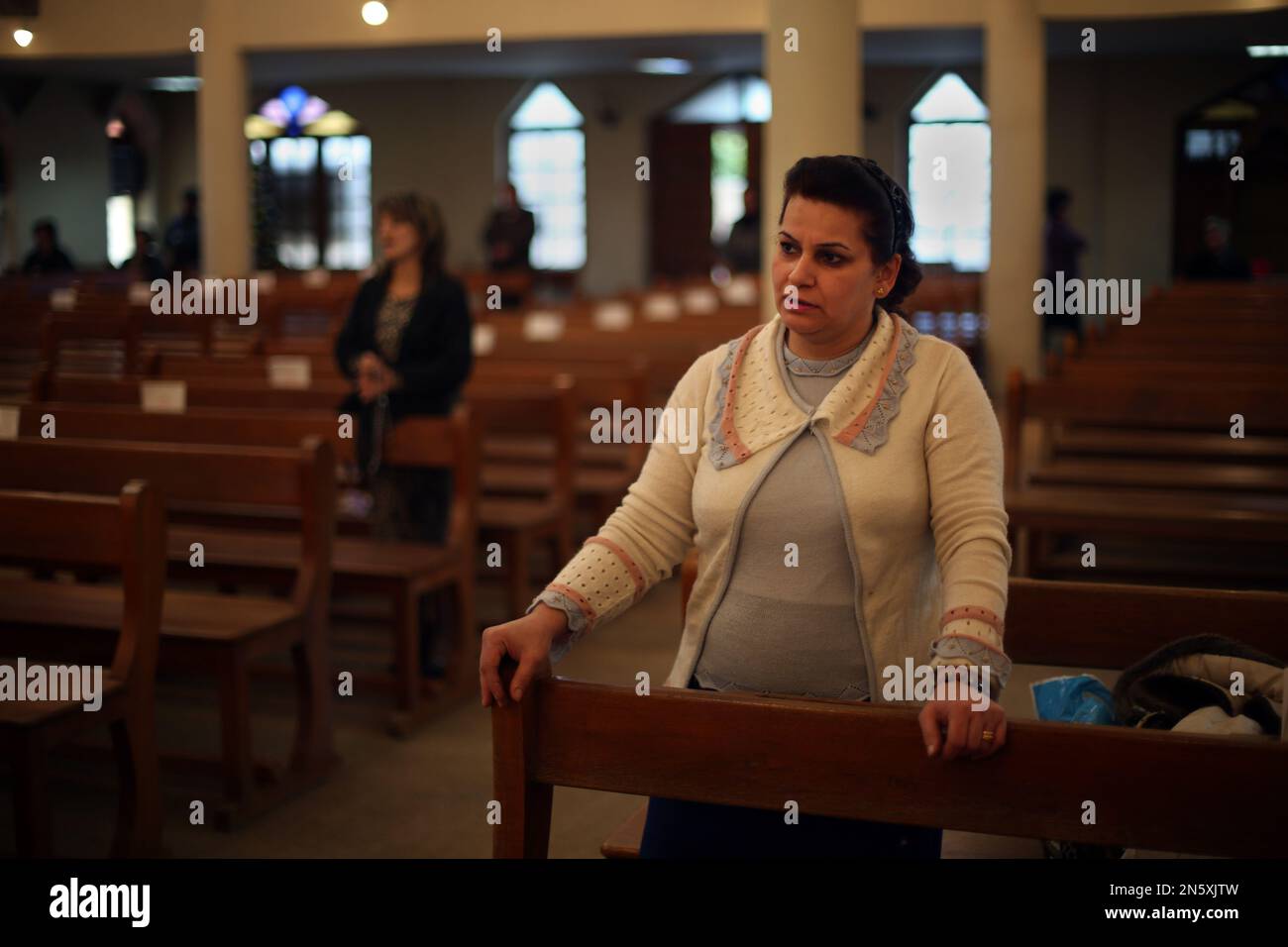 Iraqi Christians attend a Sunday mass at the Chaldean Church of Virgin ...