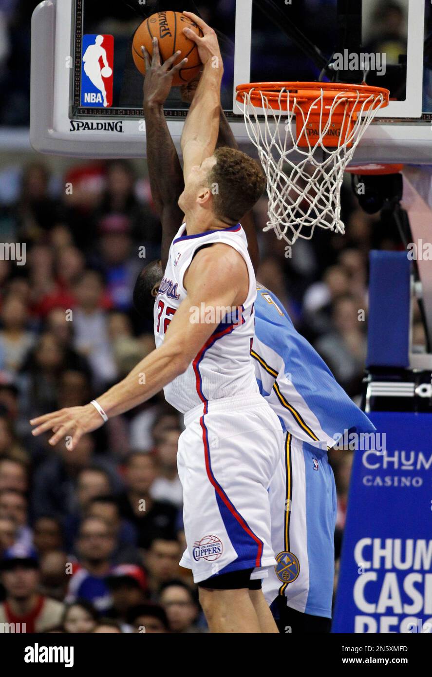 Denver Nuggets forward J.J. Hickson, right, gets his shot blocked by ...