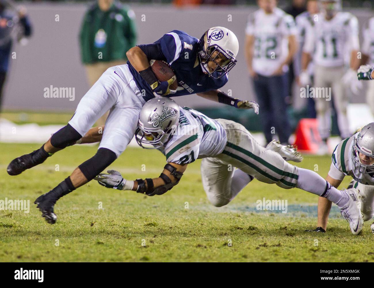 St. John Bosco's Shay Fields jumps over De La Salle's Dasmond ...