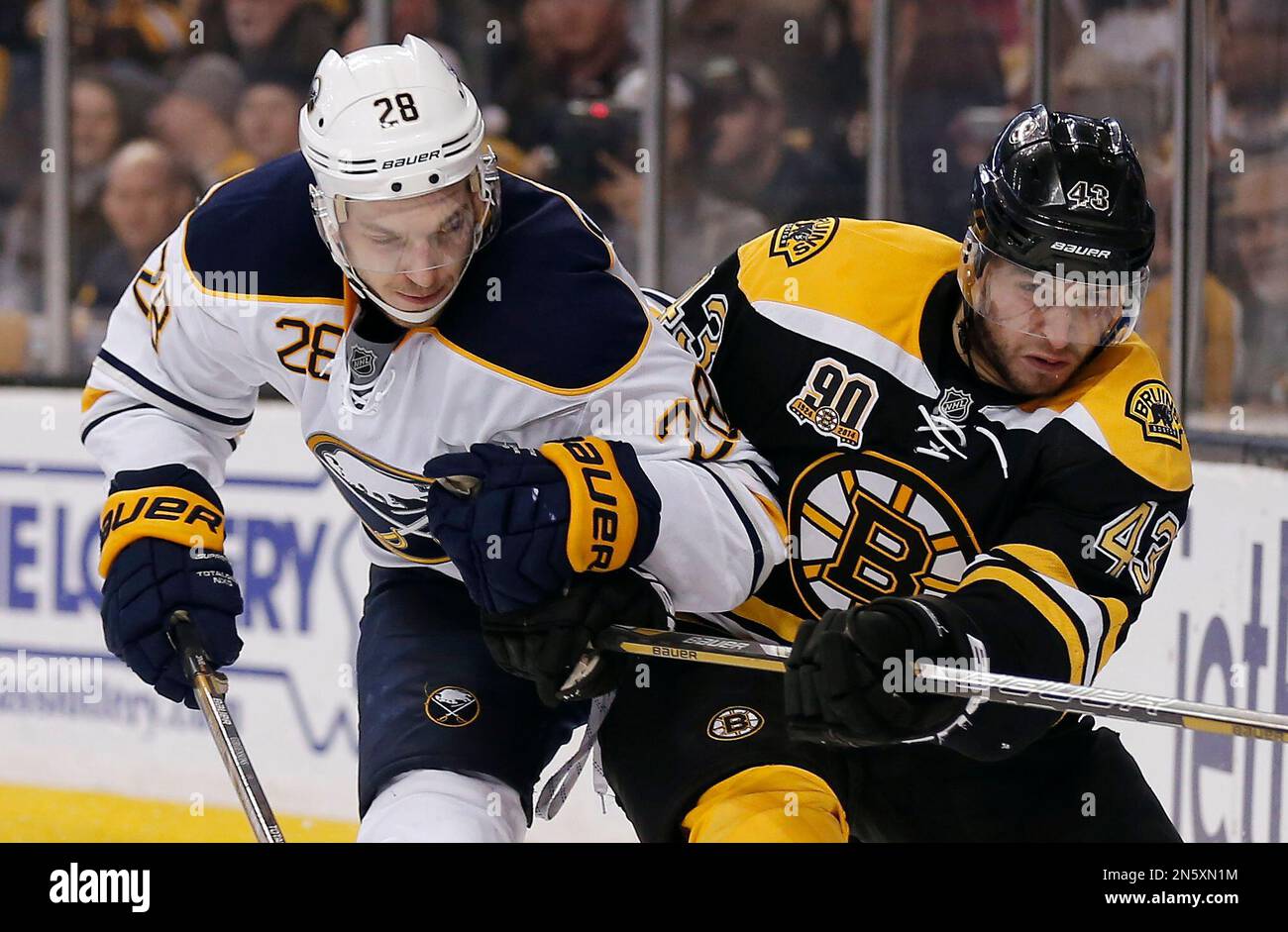 Buffalo Sabres' Zemgus Girgensons (28) battles Boston Bruins' Matt ...
