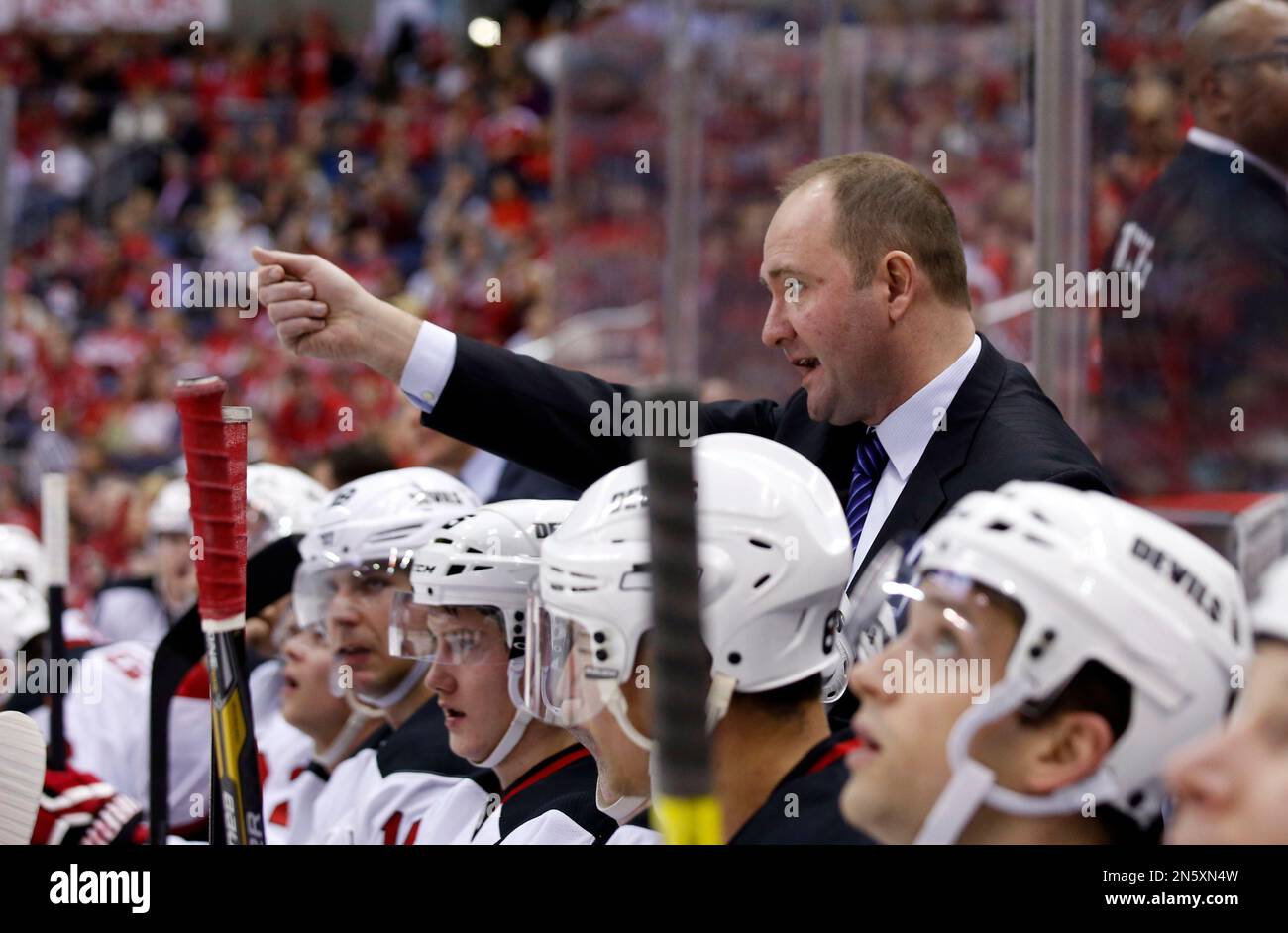 New Jersey Devils head coach Peter DeBoer directs his team in the first ...