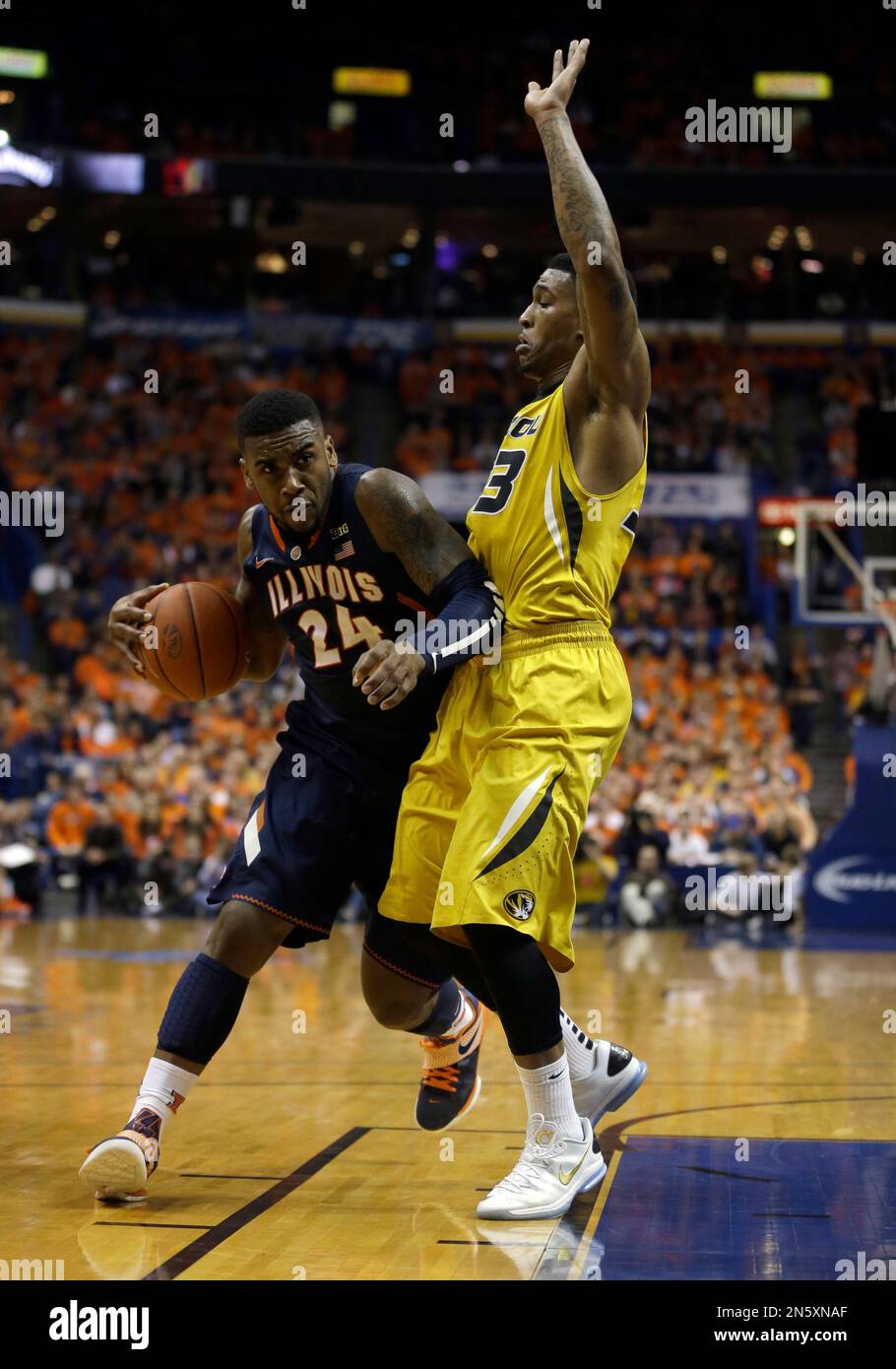 Illinois' Rayvonte Rice, left, heads to the basket past Missouri's ...