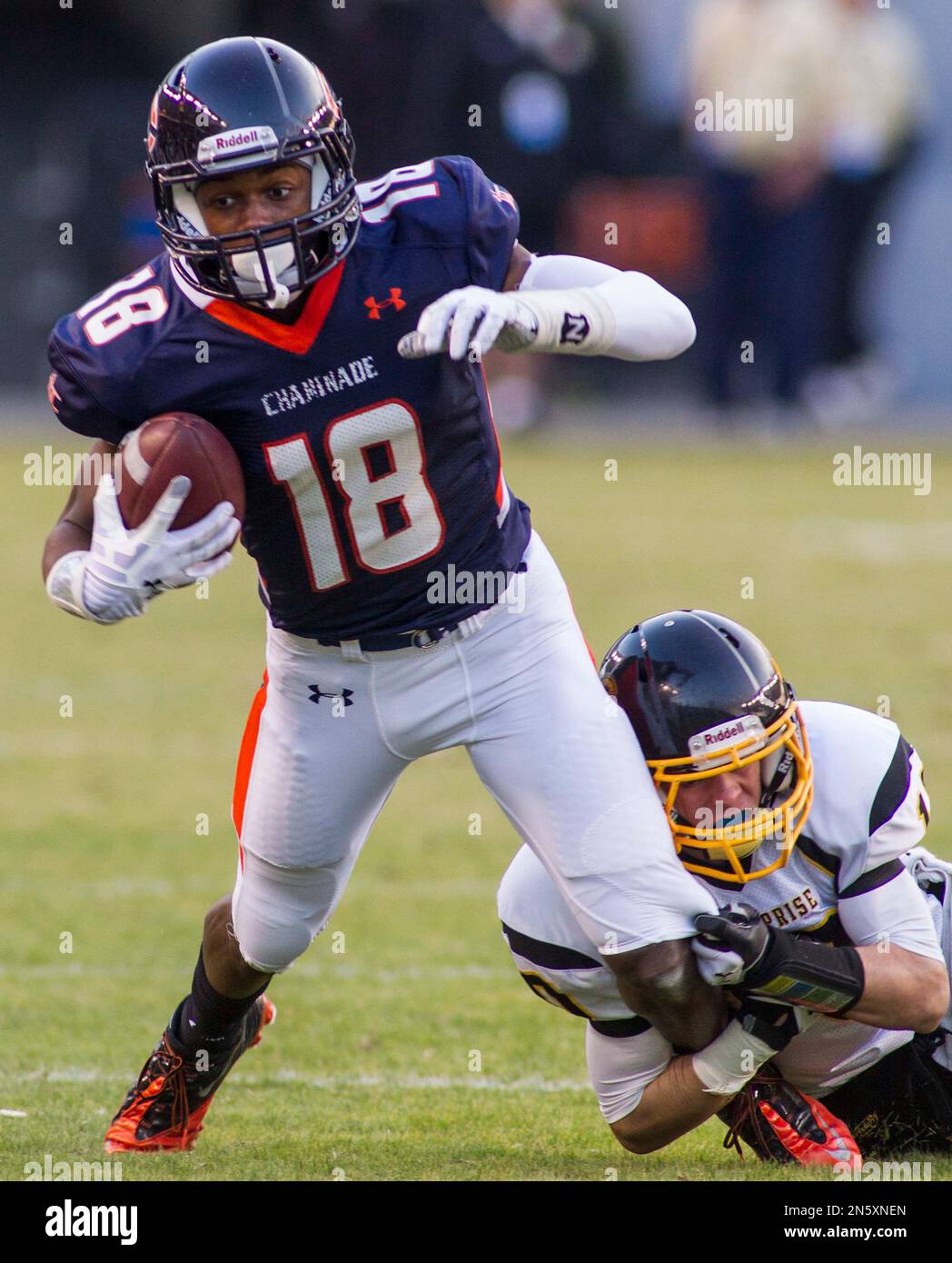 Chaminade's Brandyn Lee, front, is tackled by Enterprise's Justin Abney ...