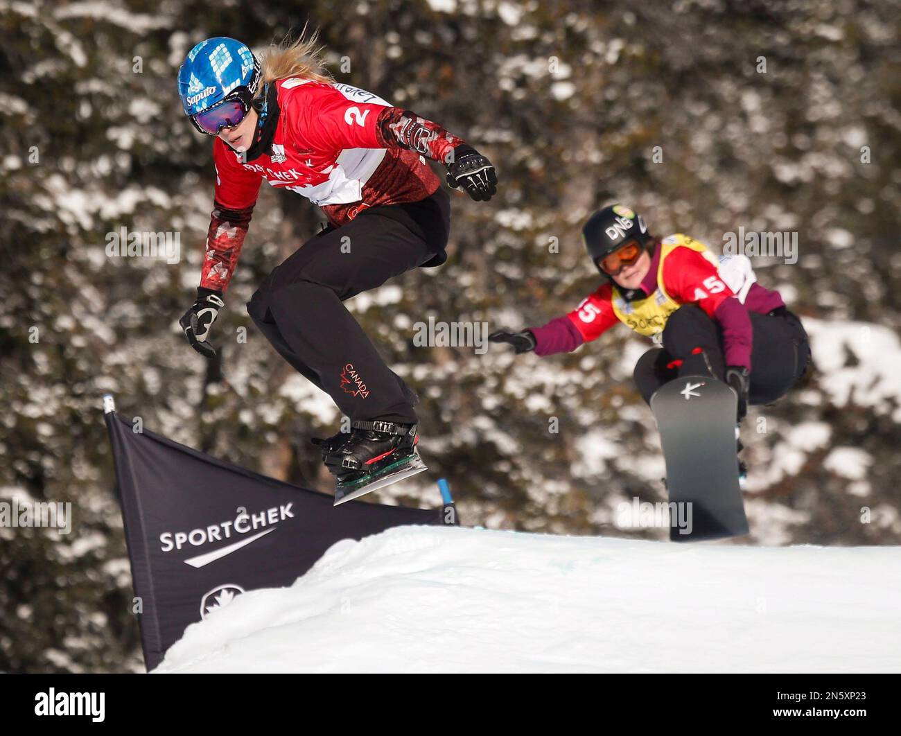 Canada's Dominique Maltais, left, races against Norway's Helene Olafsen ...