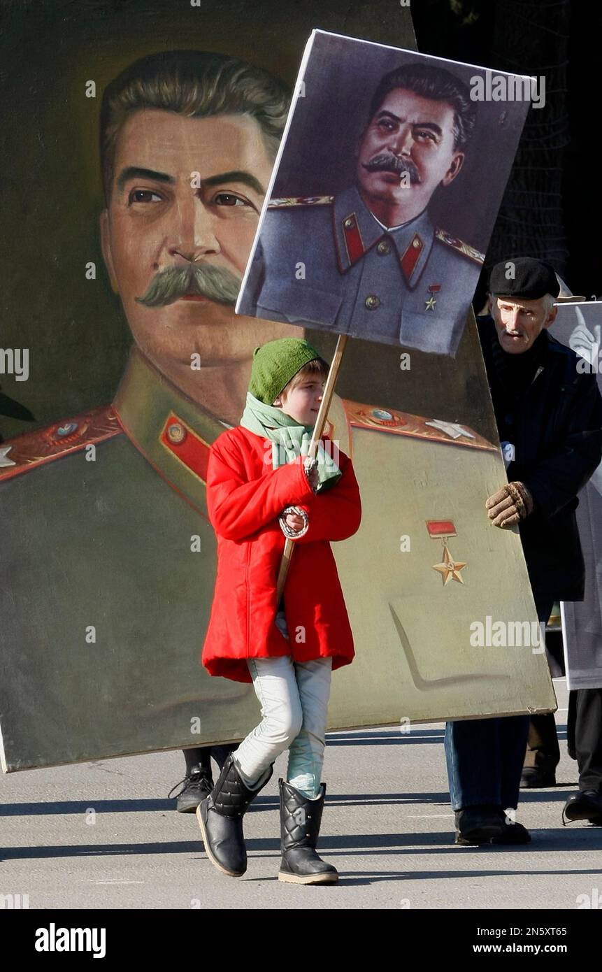 Georgians carry portraits of Soviet dictator Joseph Stalin during a ...