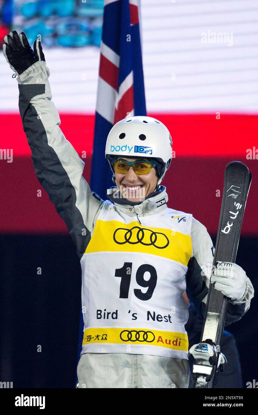 Lydia Lassila, of Australia, waves on the podium after taking the ...