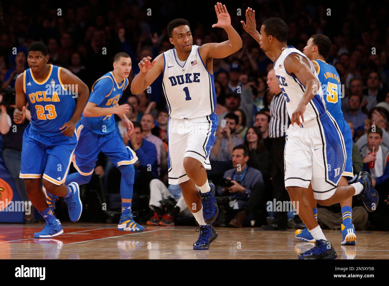 Duke's Jabari Parker (1) celebrates with teammate Rodney Hood (5) after ...