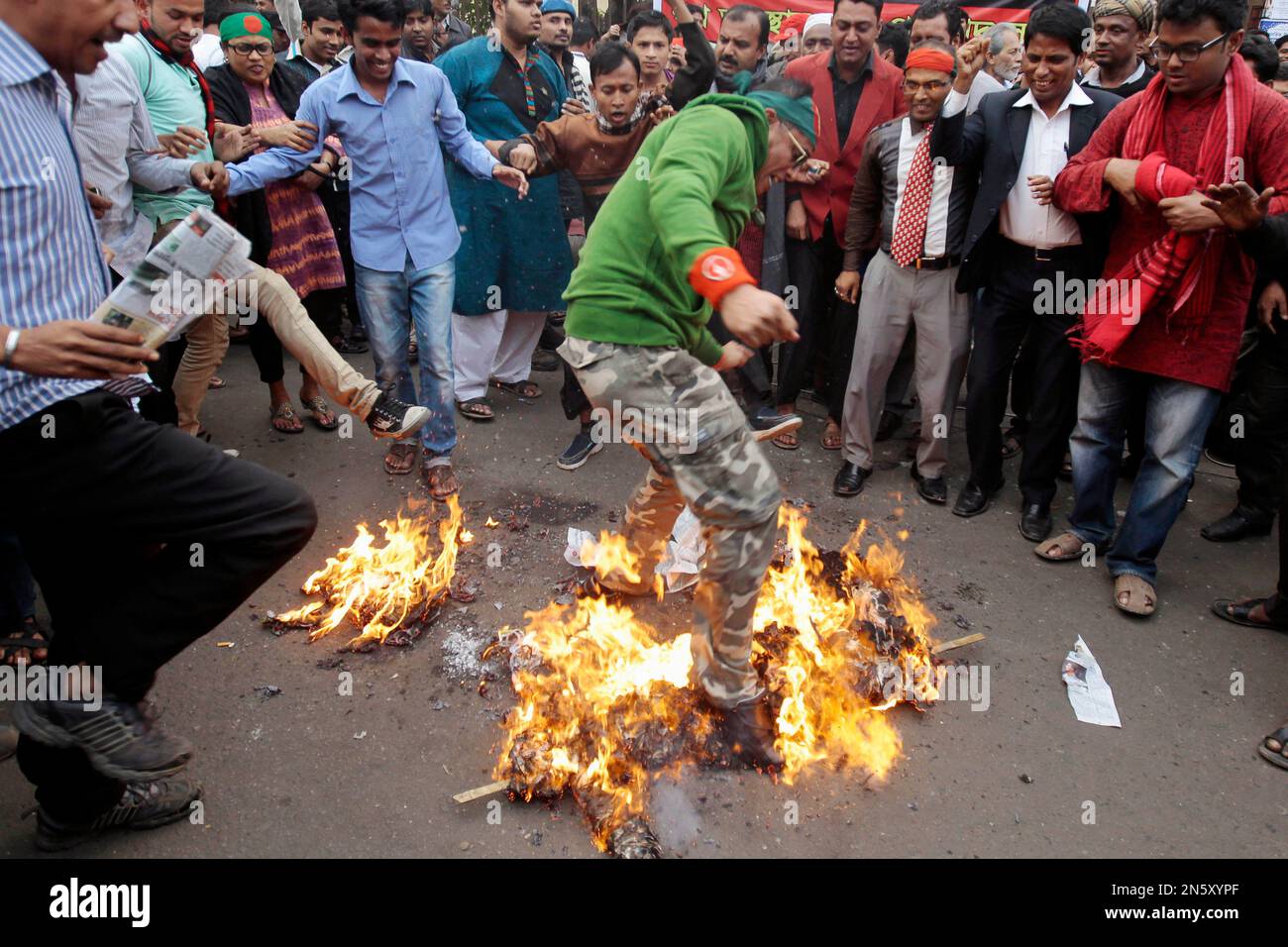 Bangladeshi activists burn an effigy of Pakistan Home Minister Chaudhry ...