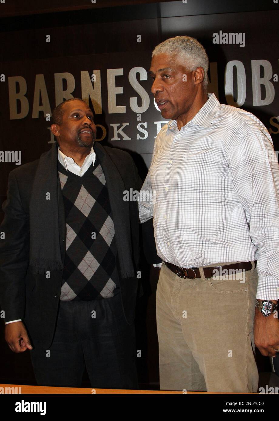 Authors and media personality Tavis Smiley and former NBA player Julius ...