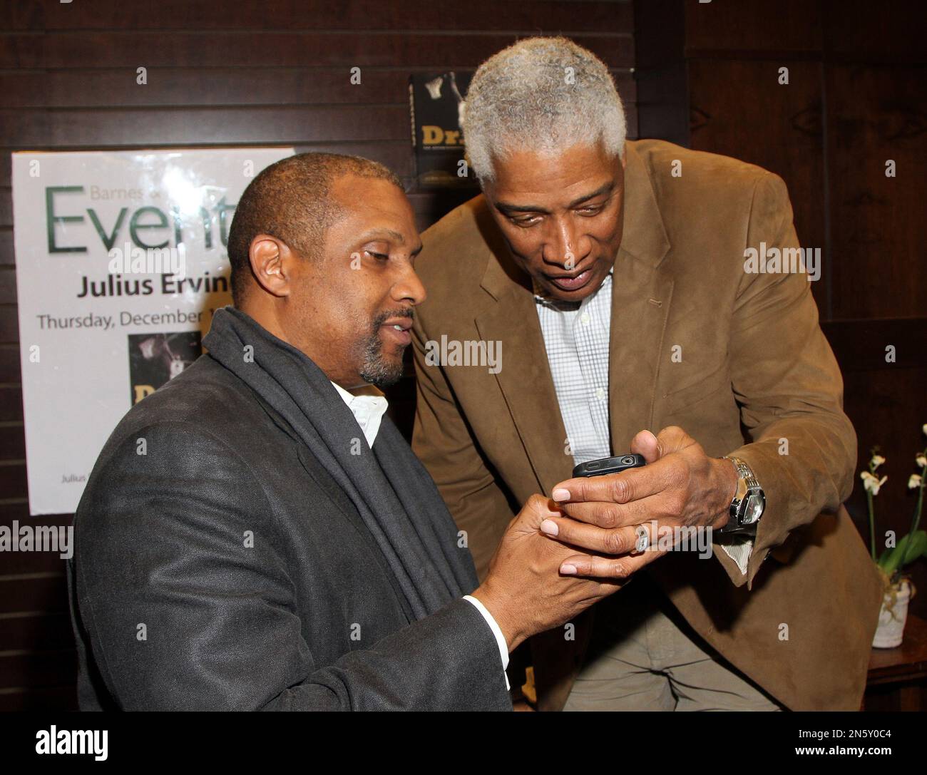 Authors and media personality Tavis Smiley and Julius Erving seen at ...
