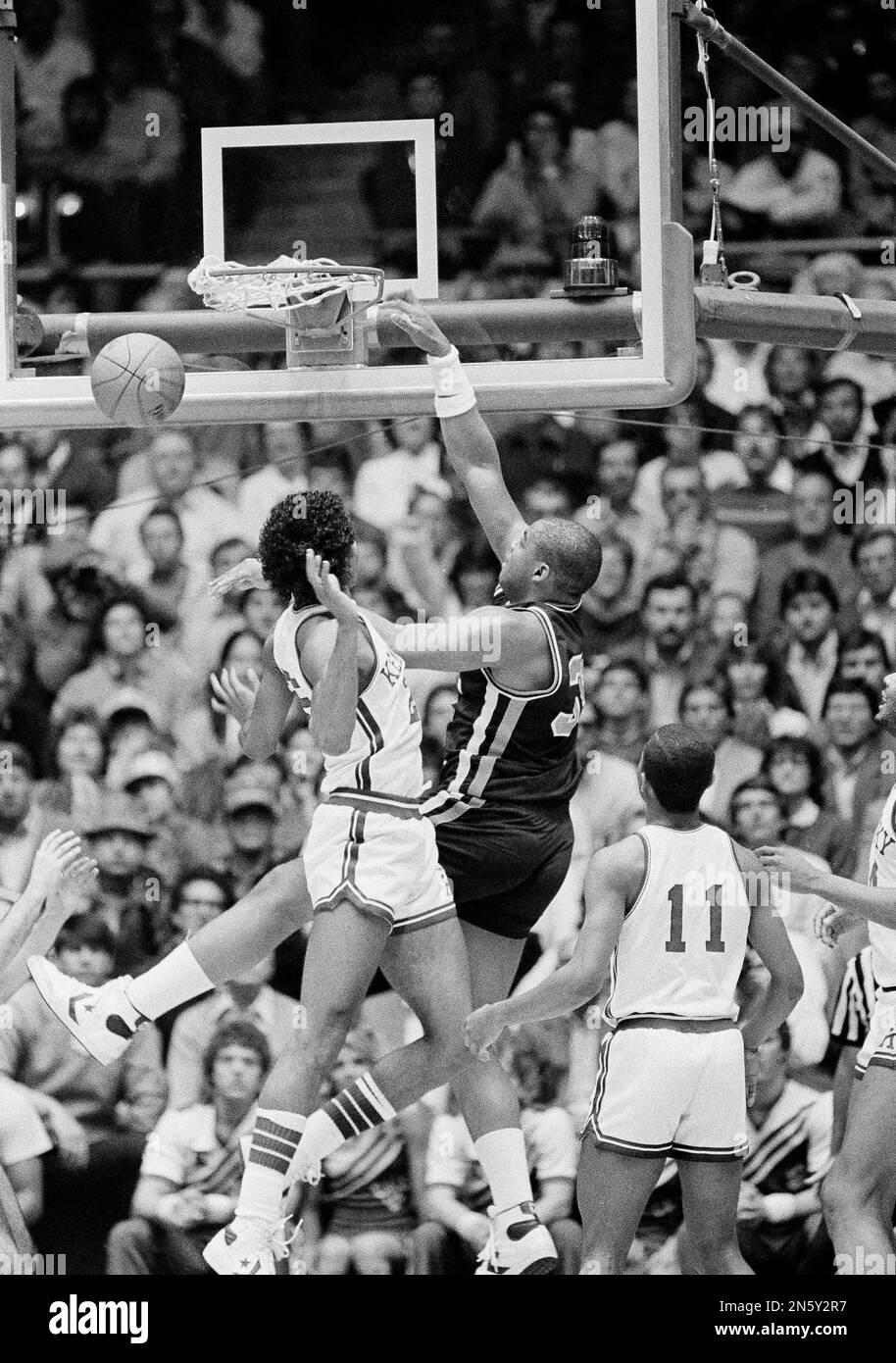 Auburn's Charles Barkley (34) dunks one despite the defensive efforts ...
