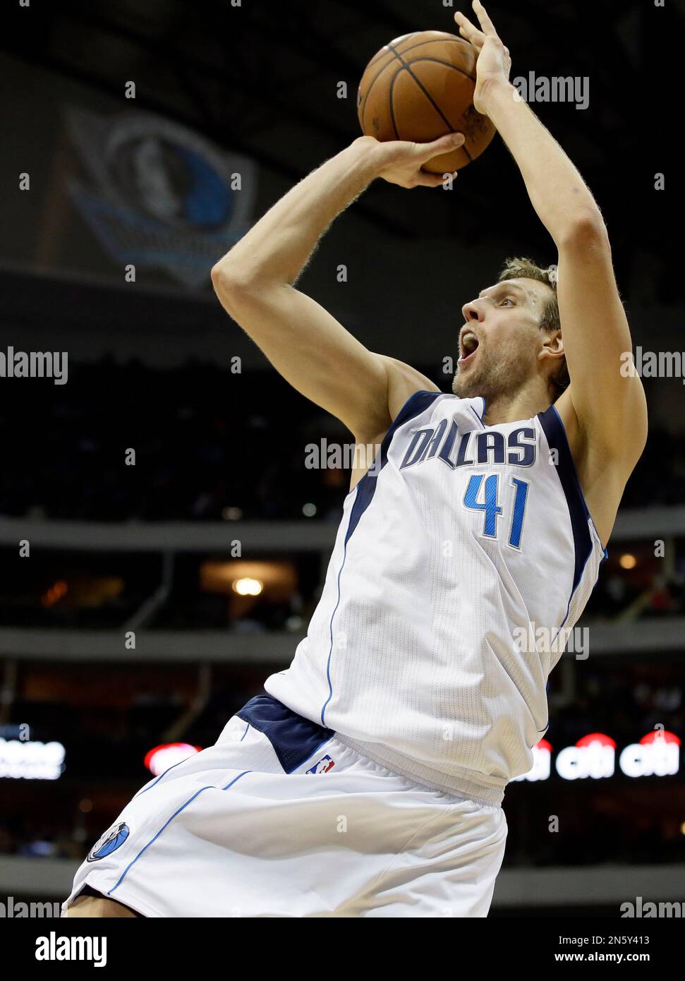 Dallas Mavericks power forward Dirk Nowitzki (41) of Germany falls back ...