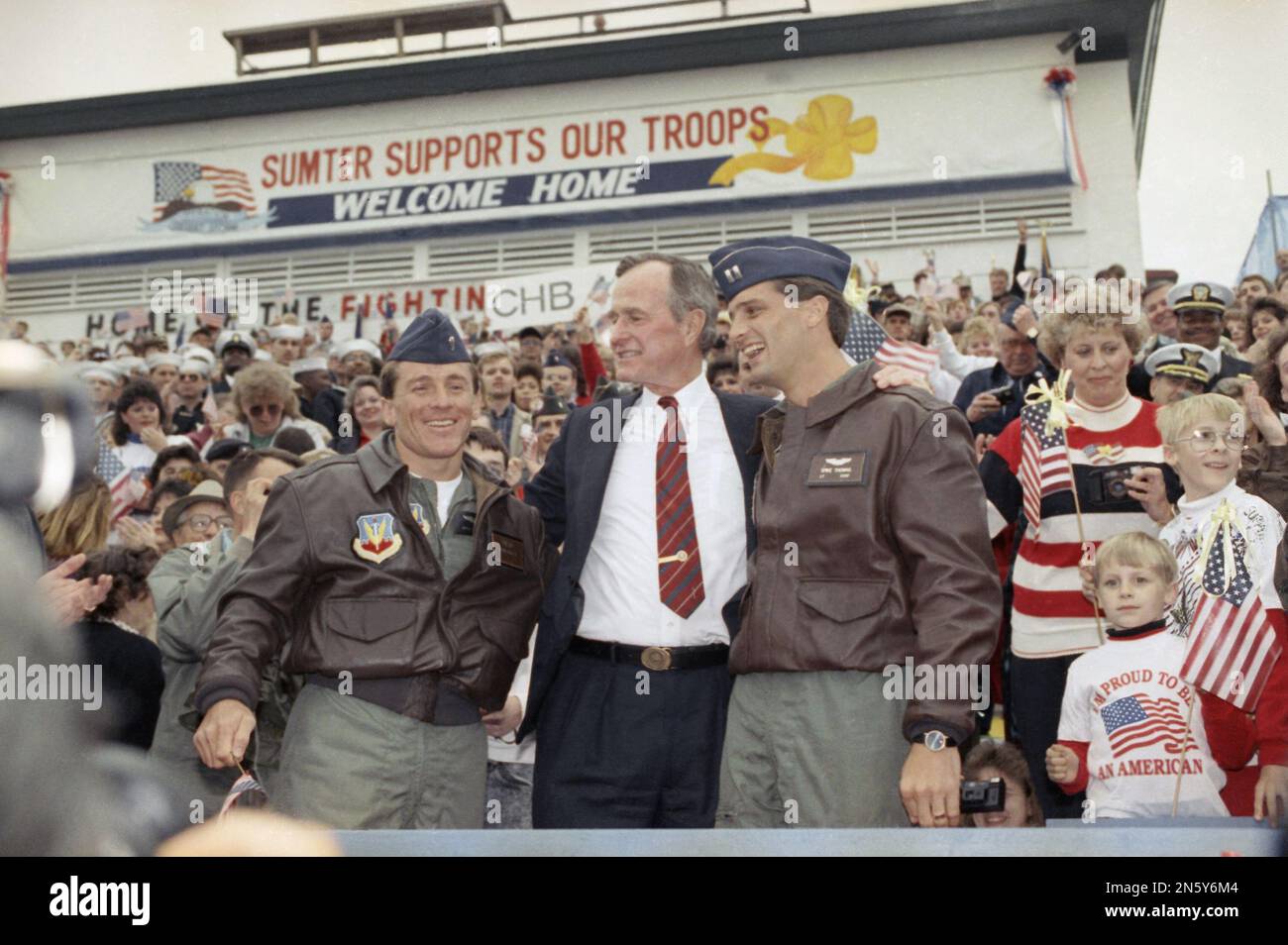 U.S. President George H. Bush with Lt. Nick Dodson who led a mission to ...