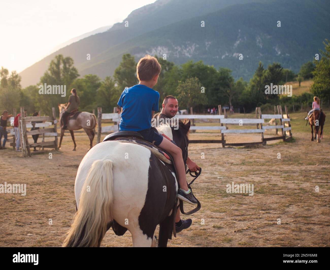 Asian child riding horse helmet hi-res stock photography and images - Alamy