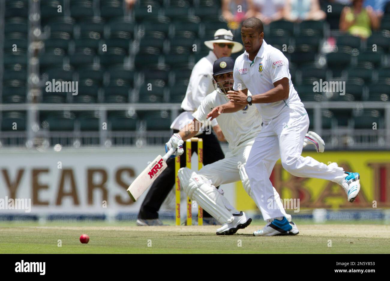 South Africa's bowler Vernon Philander, right, attempt fielding off his ...