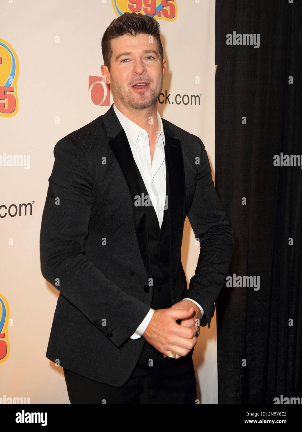 Robin Thicke poses for photographers backstage during the Hot 99.5 ...