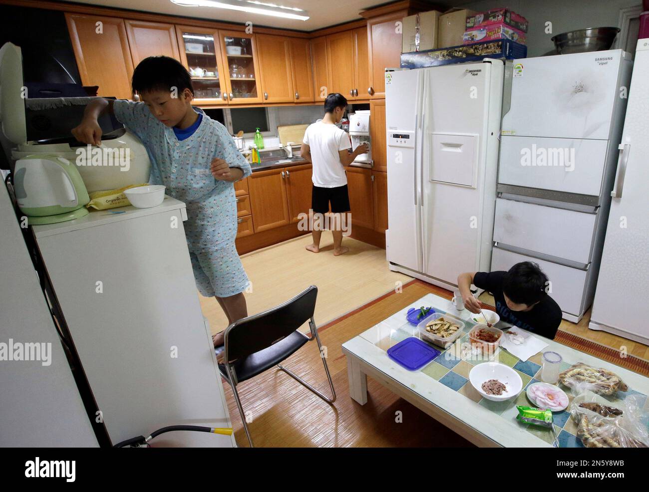 In this Oct. 29, 2013 photo, North Korean defectors, from left, Ju Cheol-kwang, Hwang Cheol-jin ...