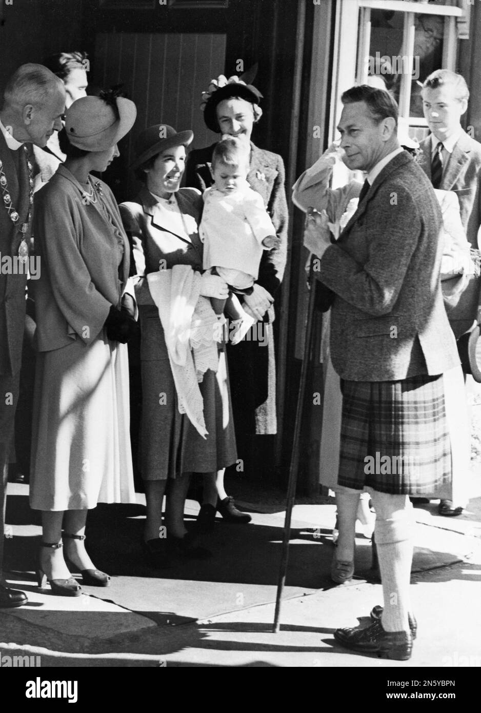 Britain's King George Vi, right, and Queen Elizabeth, hidden by the ...