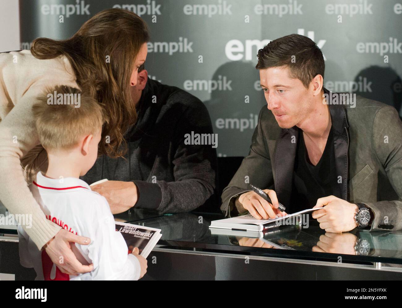 Borussia Dortmund's striker Robert Lewandowski from Poland signes a ...