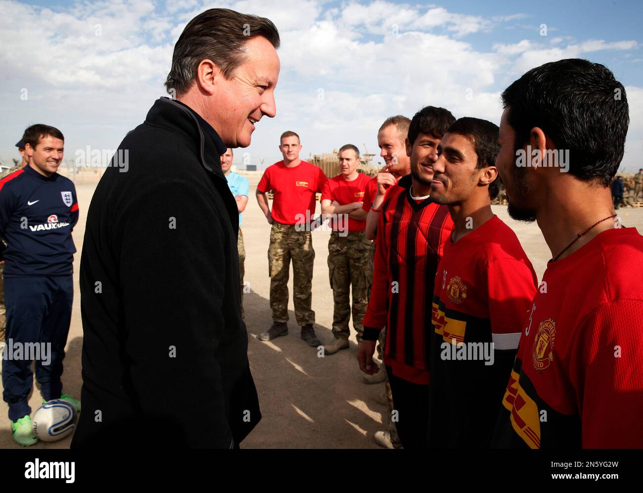 Britain's Prime Minister David Cameron, left, talks to Afghan National ...