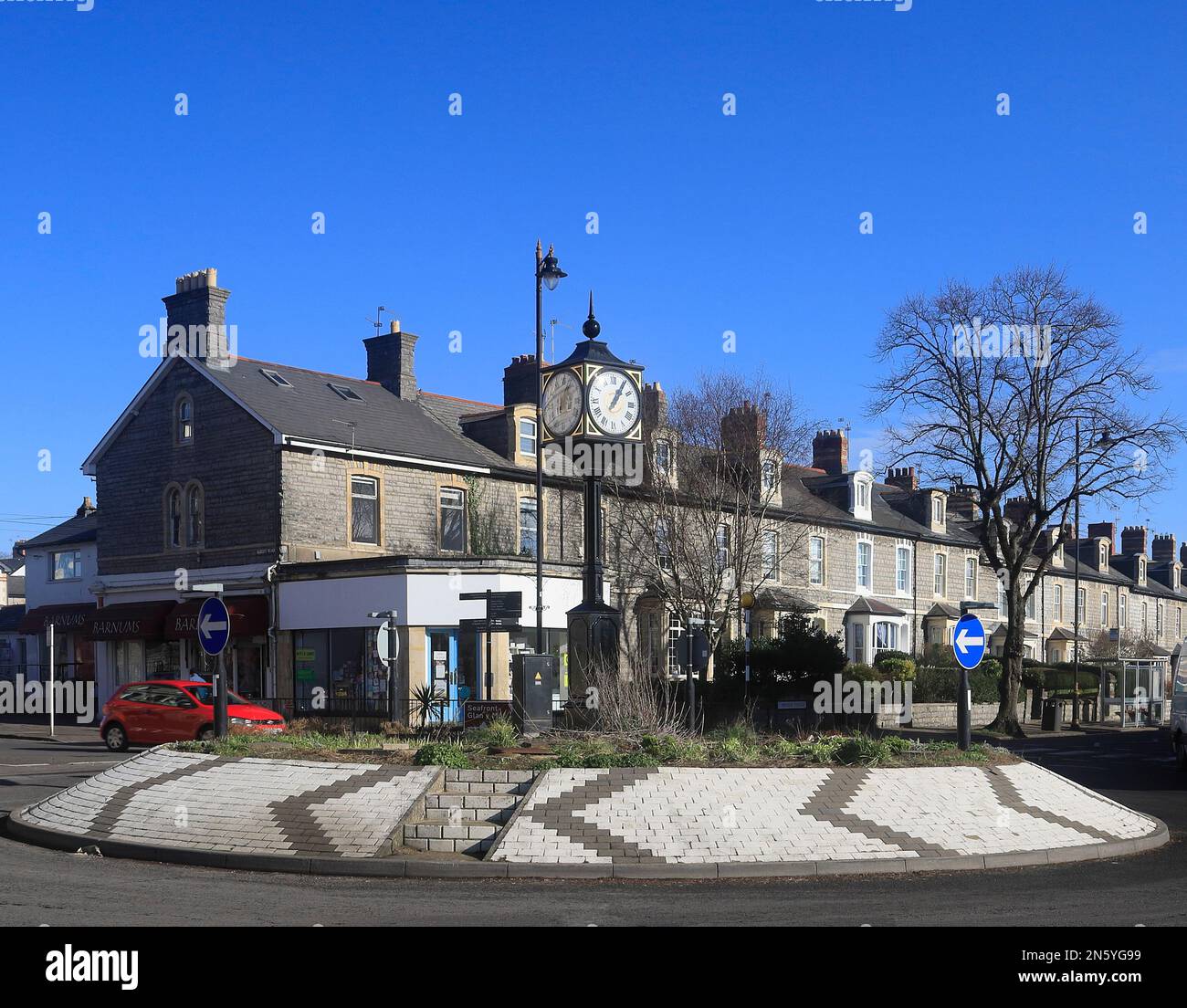 Traffic island with clock, town centre, Penarth, Vale of Glamorgan ...