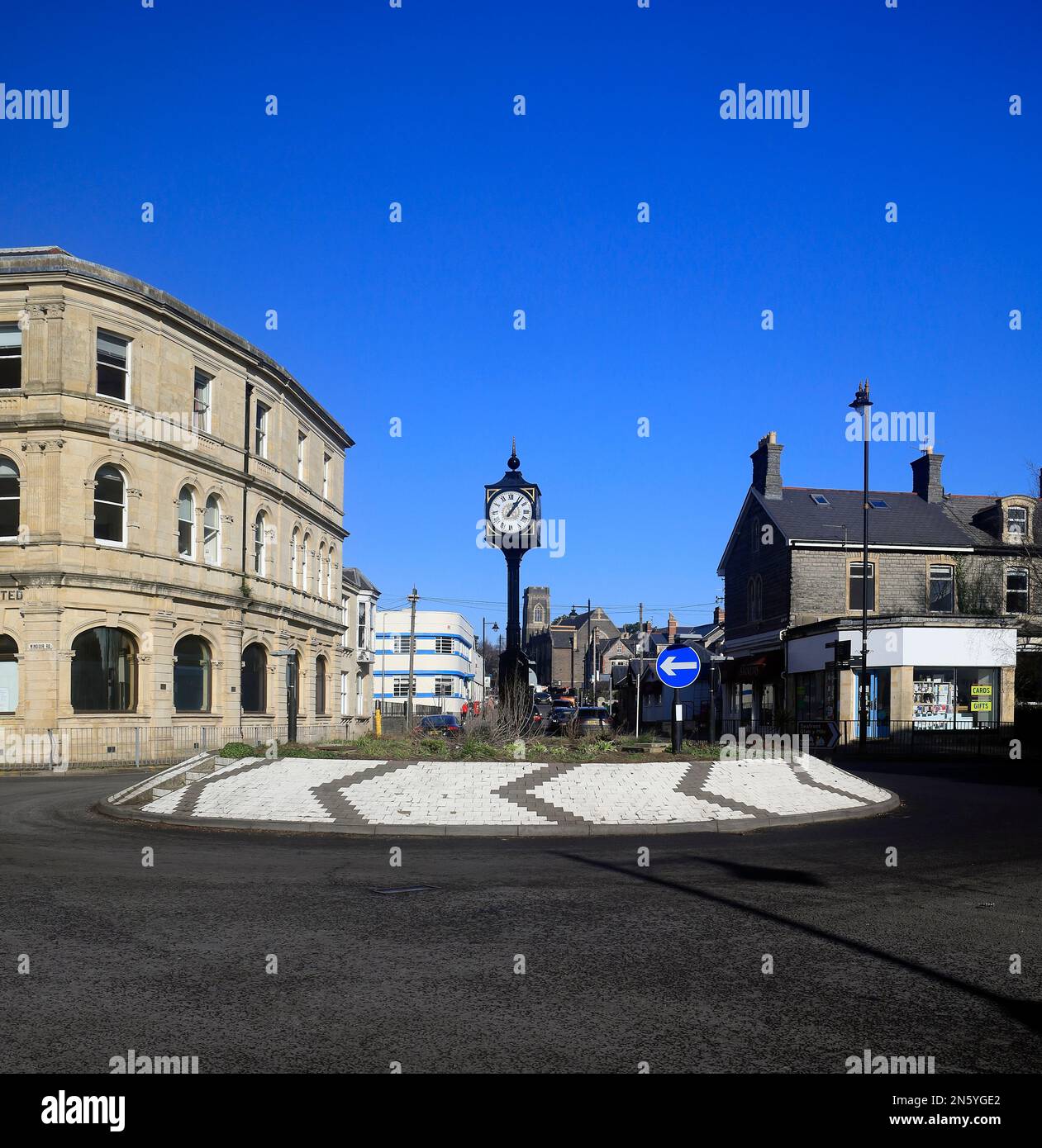 Traffic island with clock, town centre, Penarth, Vale of Glamorgan ...