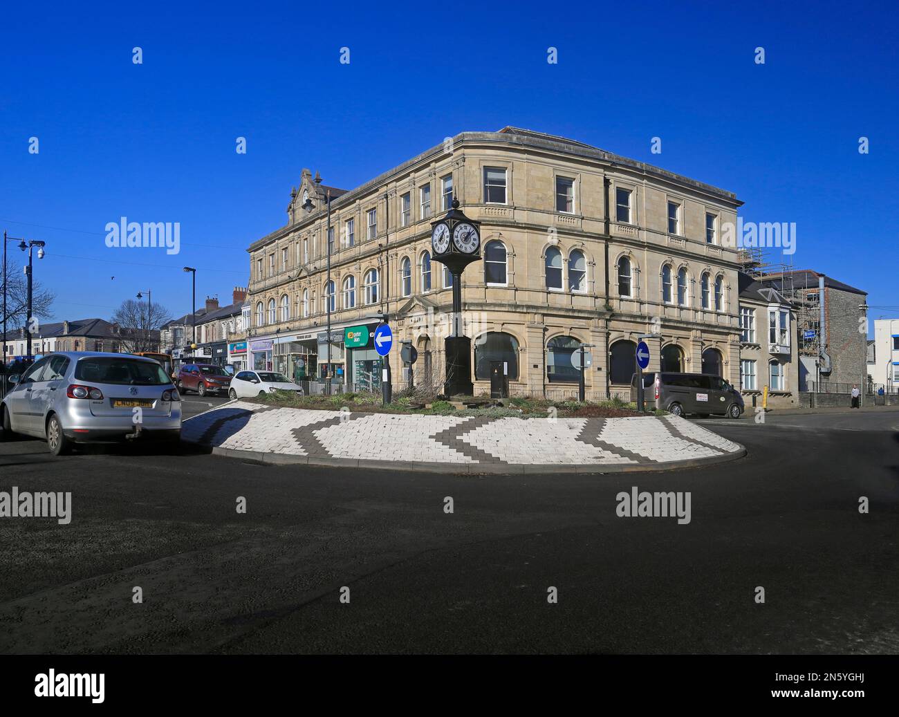 Traffic island with clock, town centre, Penarth, Vale of Glamorgan ...