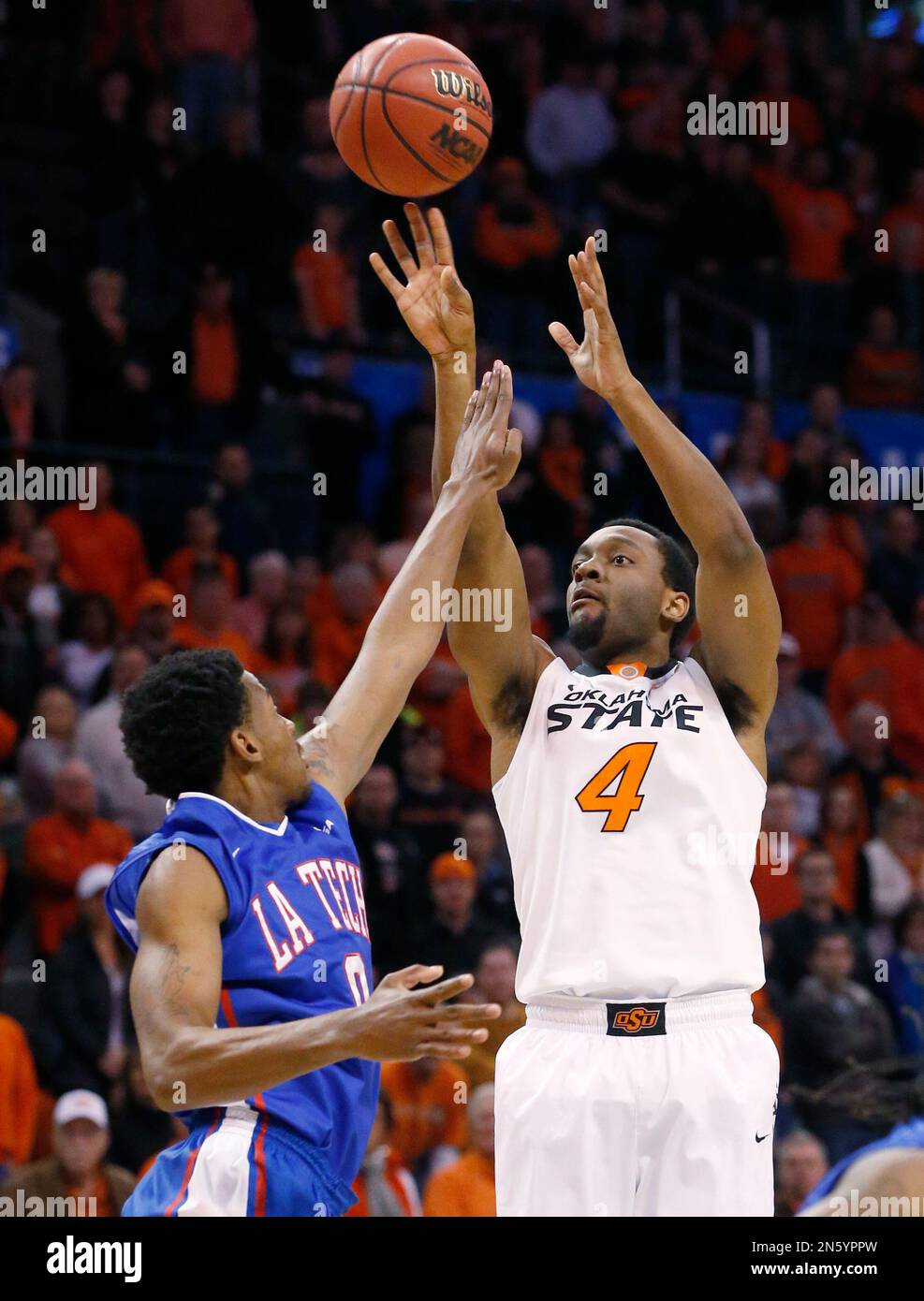 Oklahoma State wing Brian Williams (4) shoots during an NCAA college ...