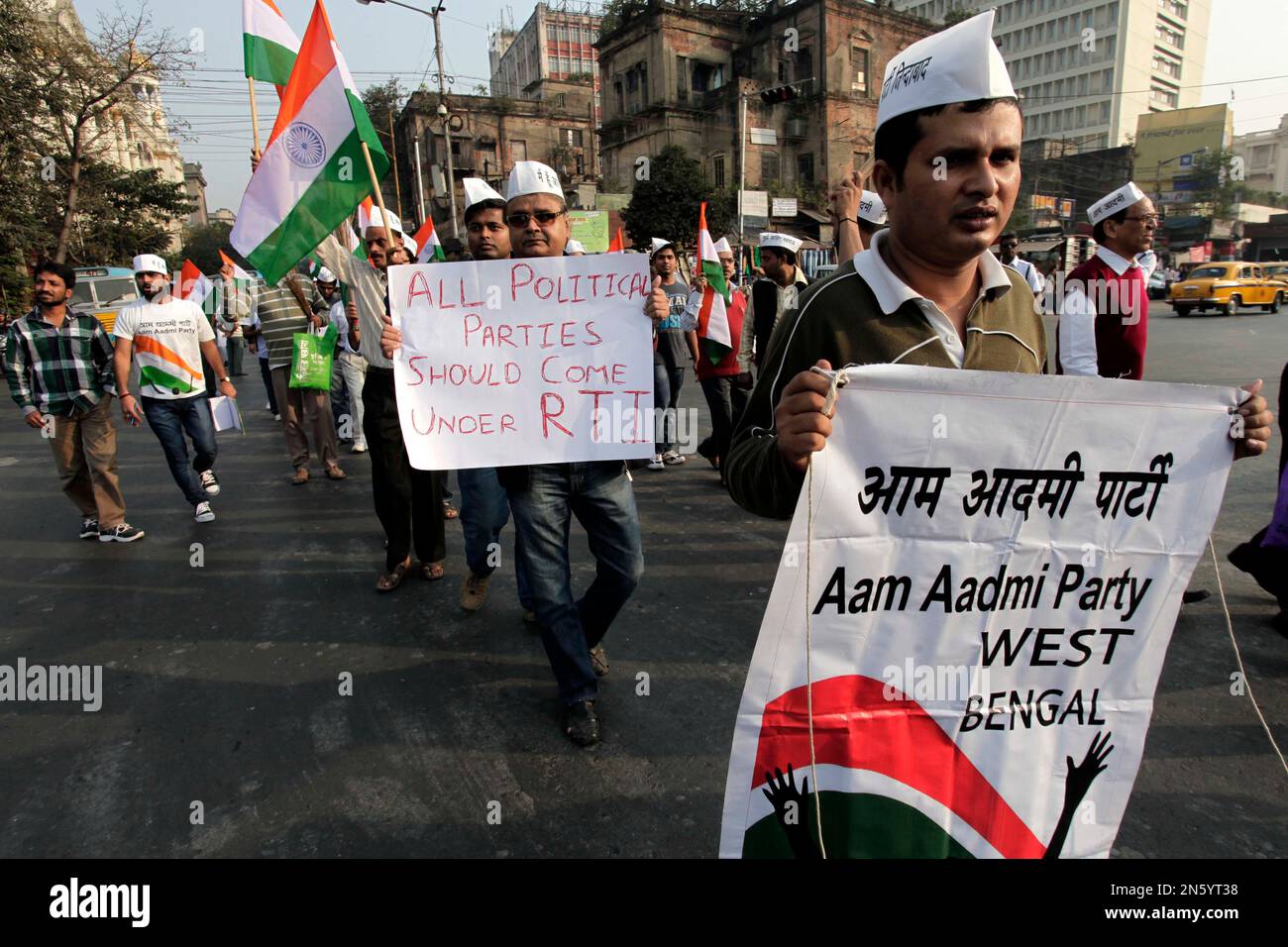 Activists of Aam Admi Party or the Common Man's party walk in a rally ...