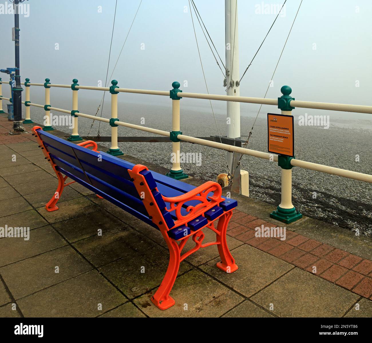 Orange and blue Friendship bench with sign at Penarth promenade, Vale ...