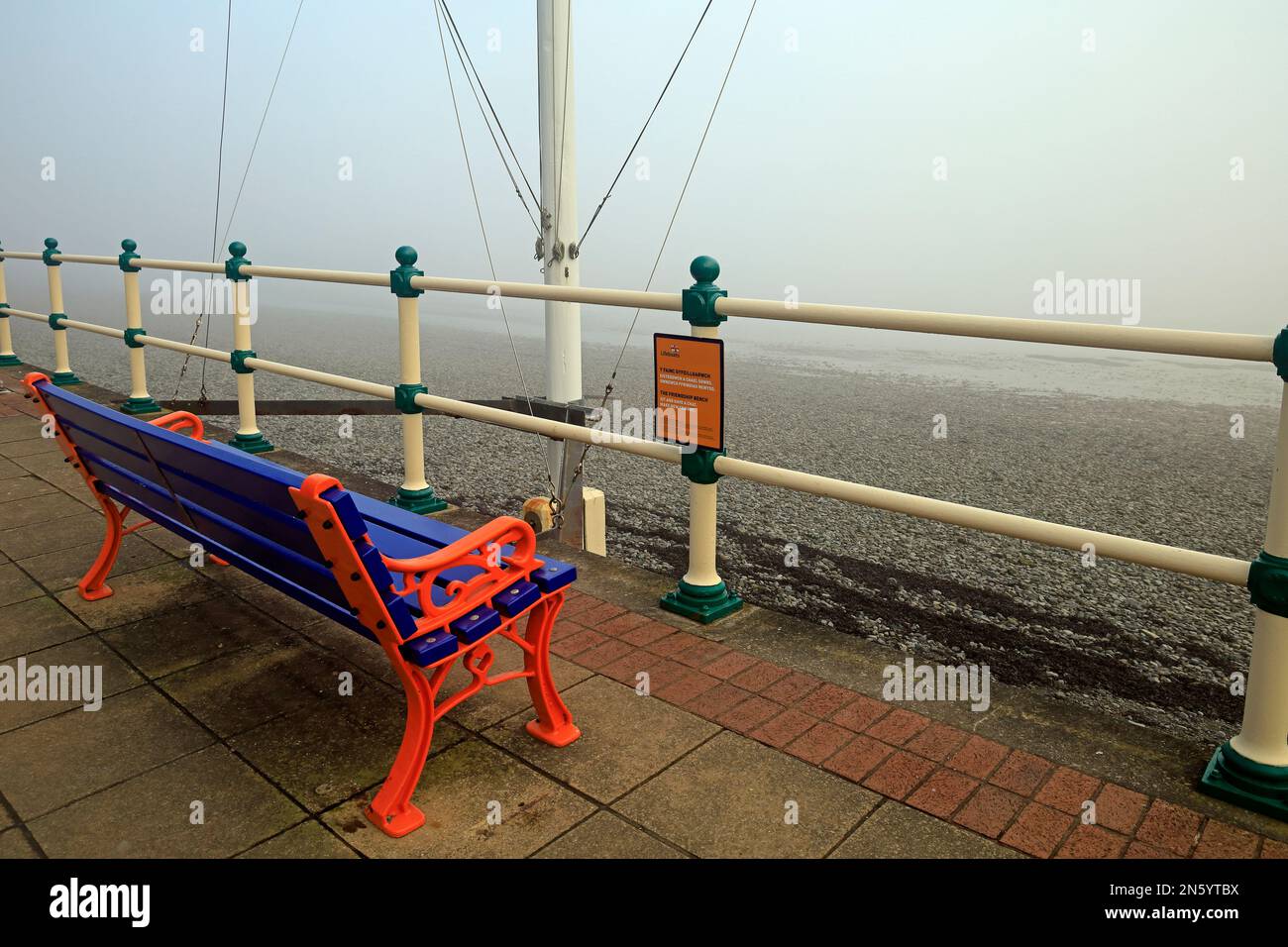 Orange and blue Friendship bench with sign at Penarth promenade, Vale ...