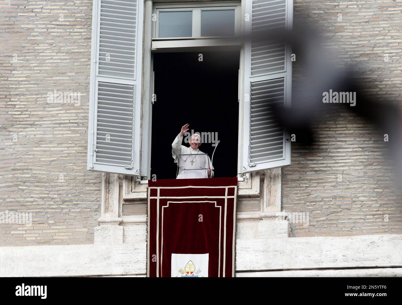 Pope Francis blesses the faithful during the Angelus prayer, in St ...