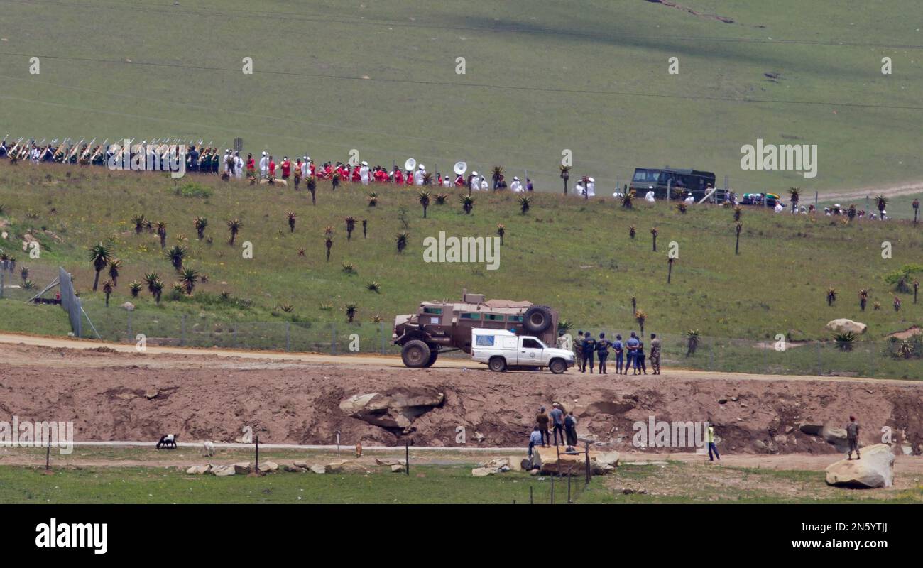 The casket of Nelson Mandela is brought to the burial site in Qunu ...