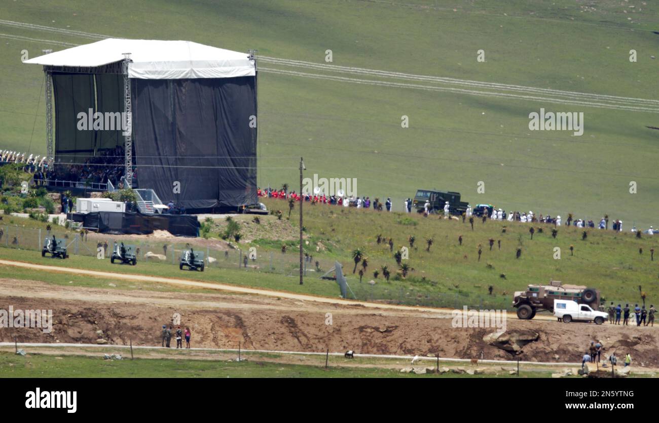 The casket of Nelson Mandela is brought to the burial site in Qunu ...