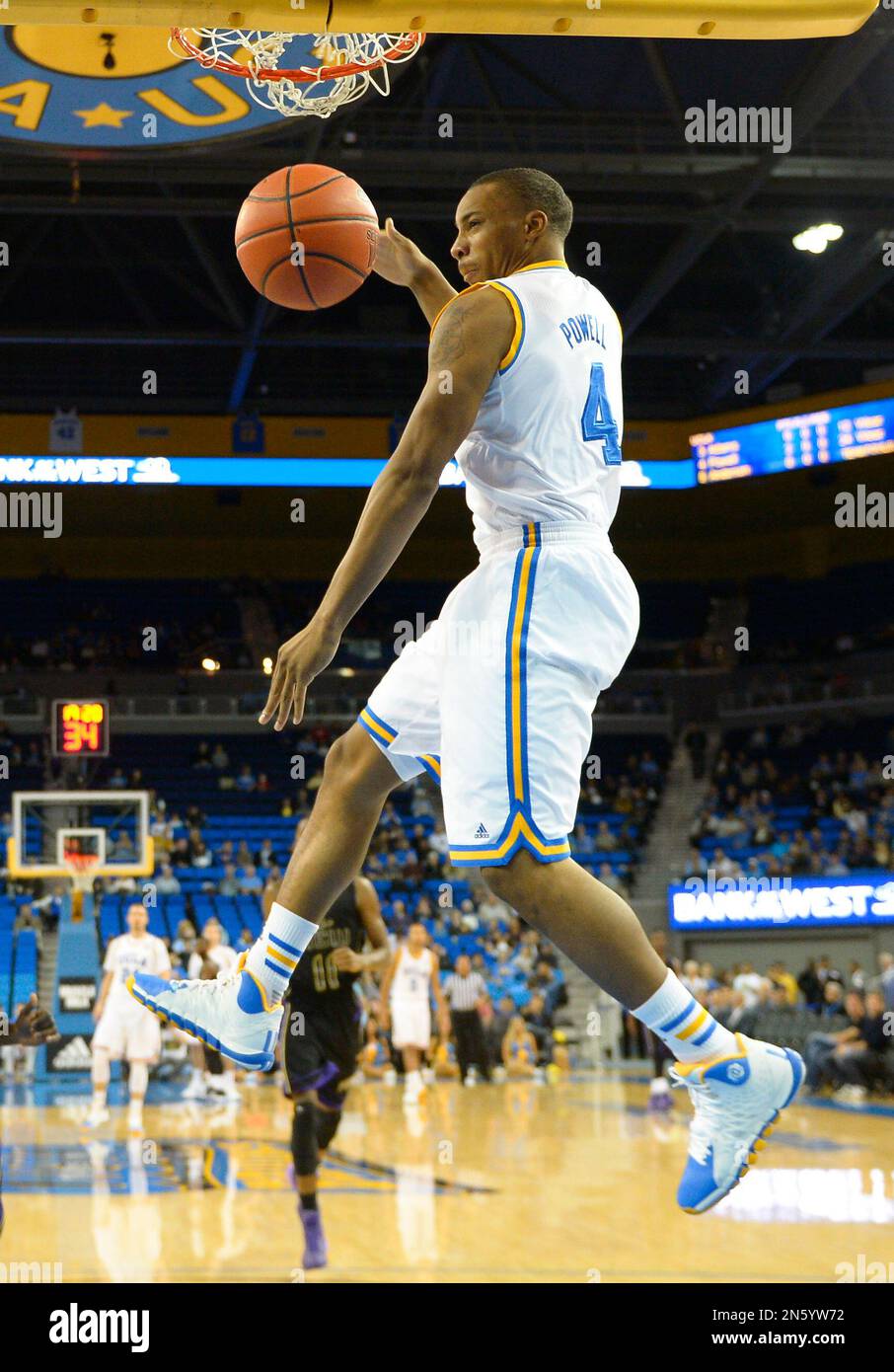 UCLA guard Norman Powell dunks during the first half of an NCAA college ...