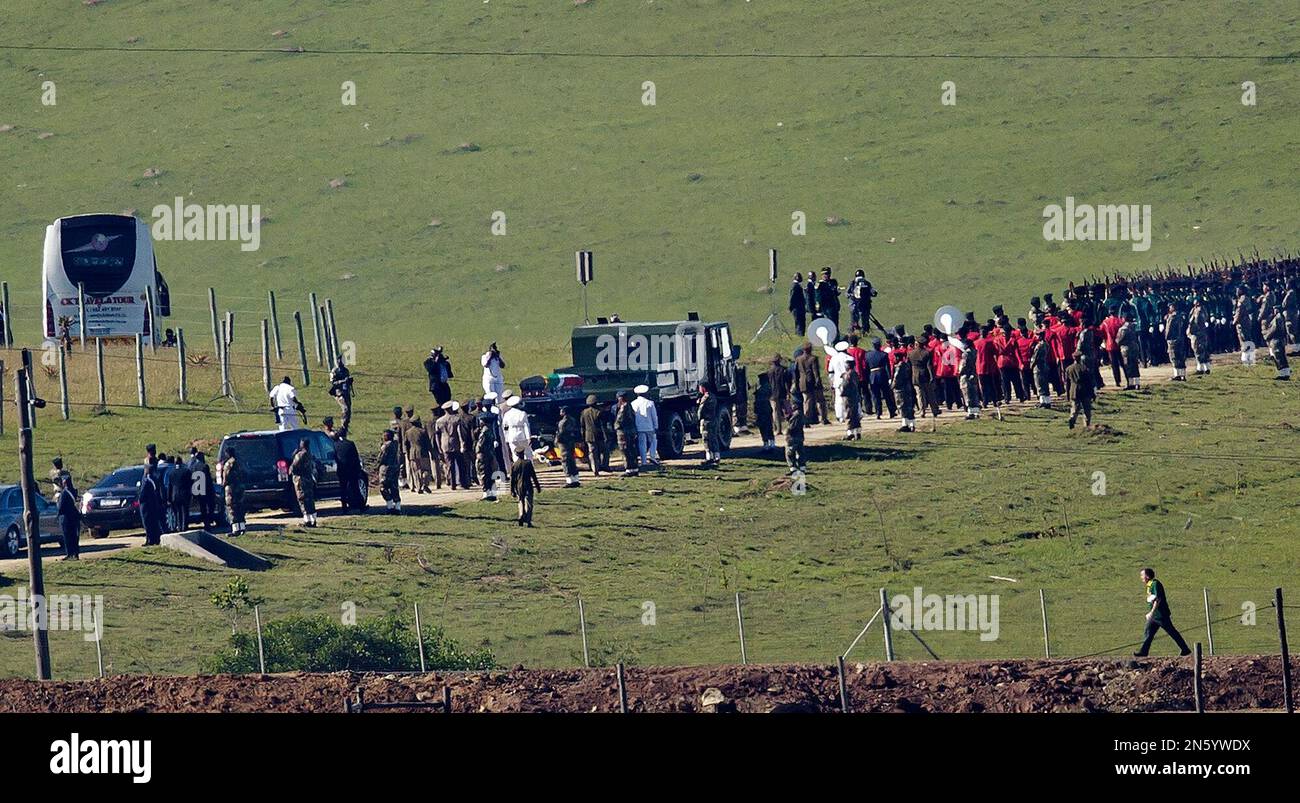 The casket of Nelson Mandela is brought in a military parade on a gun ...
