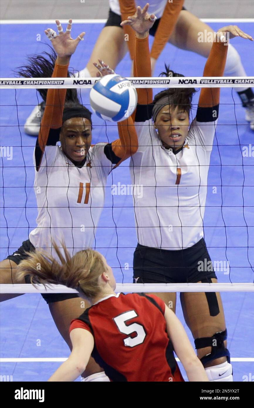 Texas' Chiaka Ogbogu (11) and Khat Bell (1) block a kill attempt by ...