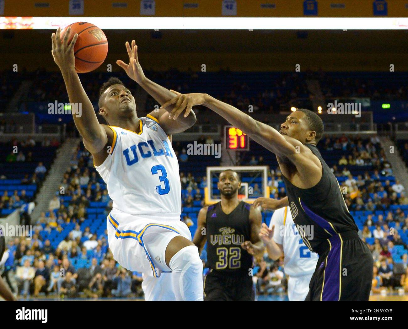 UCLA guard Jordan Adams, left, puts up a shot as Prairie View forward ...