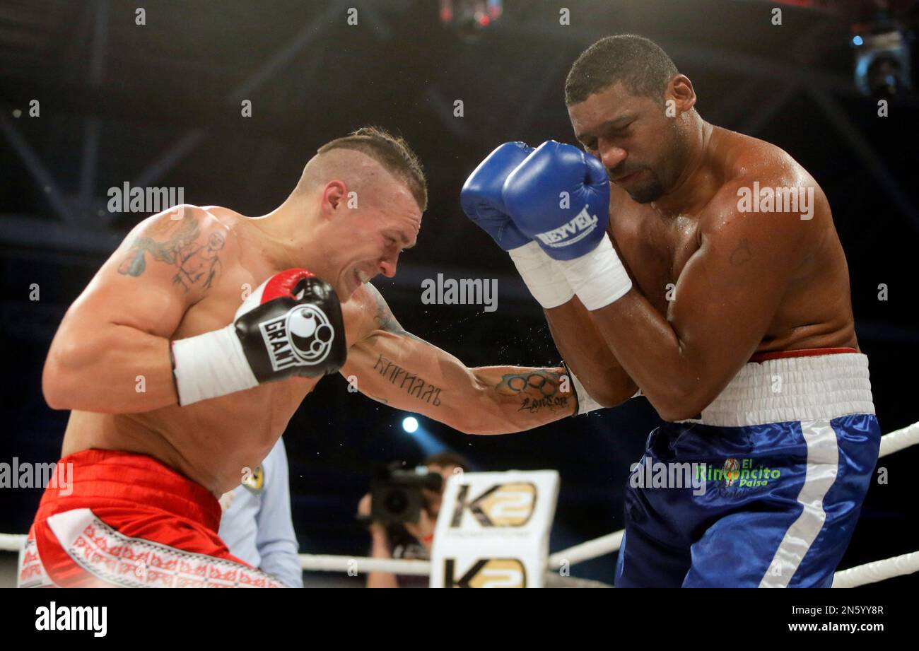Olympic boxing champion Oleksandr Usyk from Ukraine, left, throws a ...
