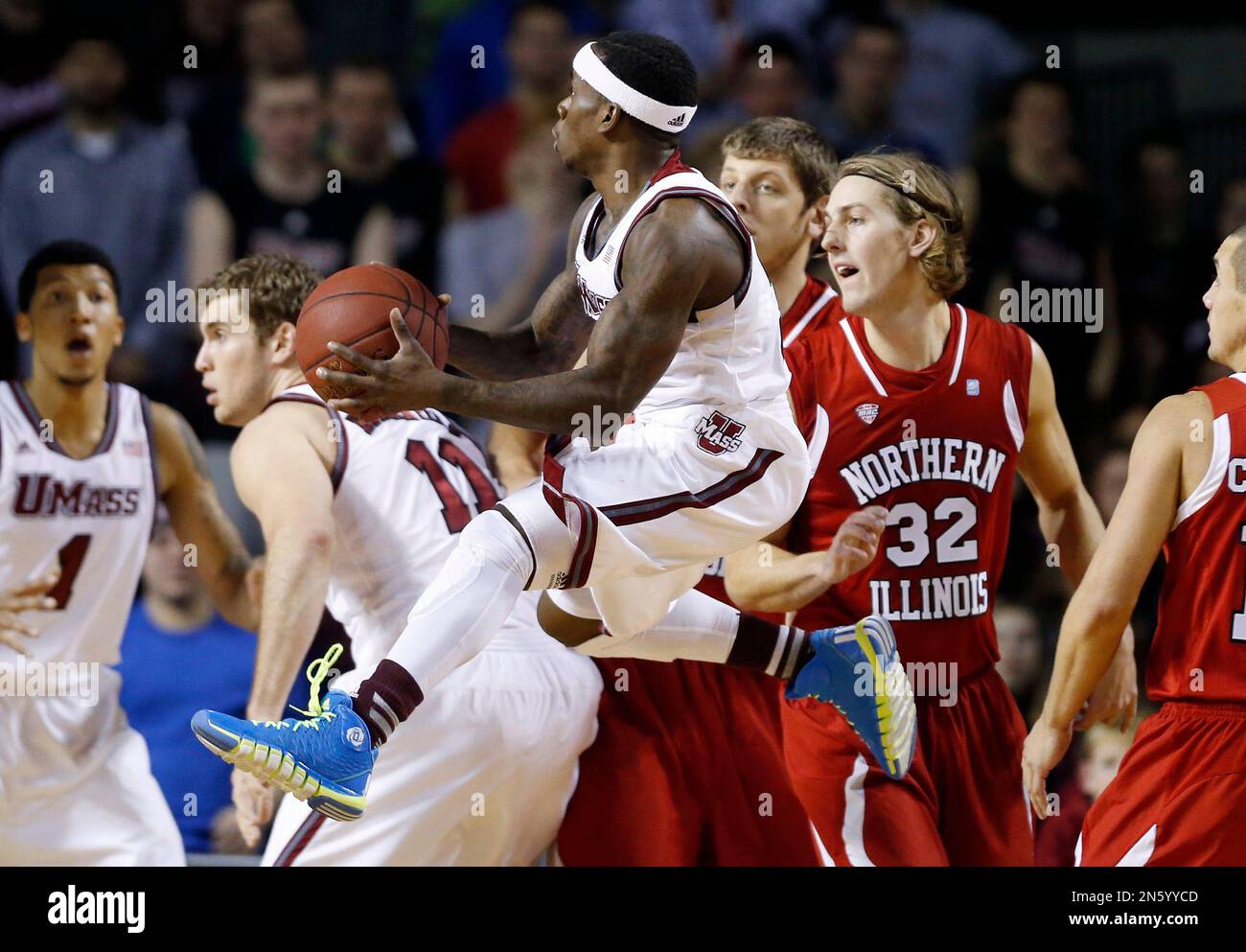 Massachusetts' Chaz Williams (3) goes up to shoot past Northern ...