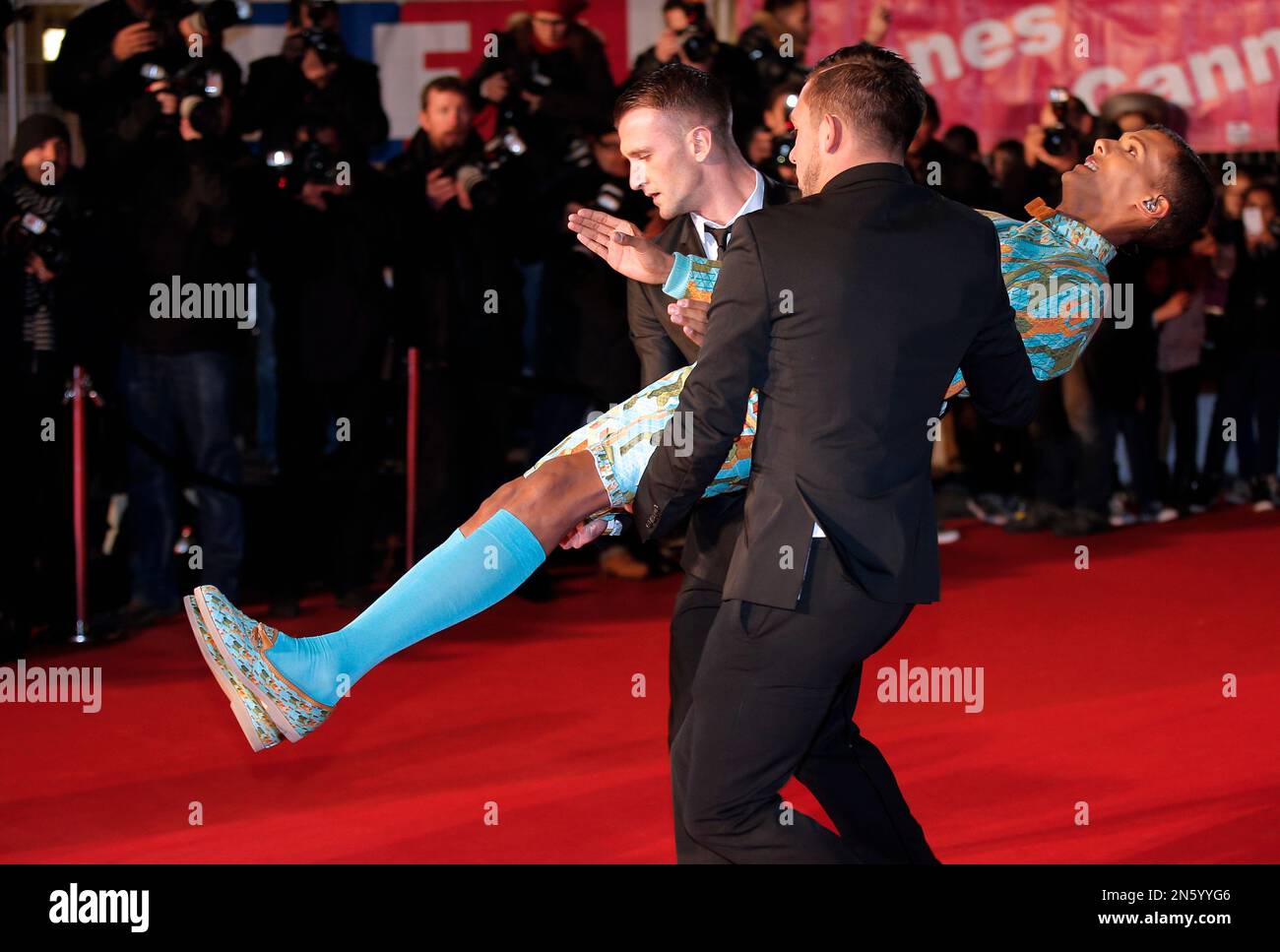 Belgian singer-songwriter Stromae arrives carried by two body guards at ...