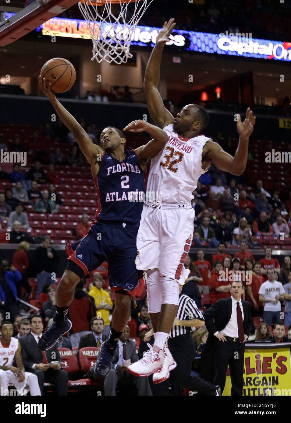Florida Atlantic guard Marquan Botley, left, shoots over Maryland guard ...