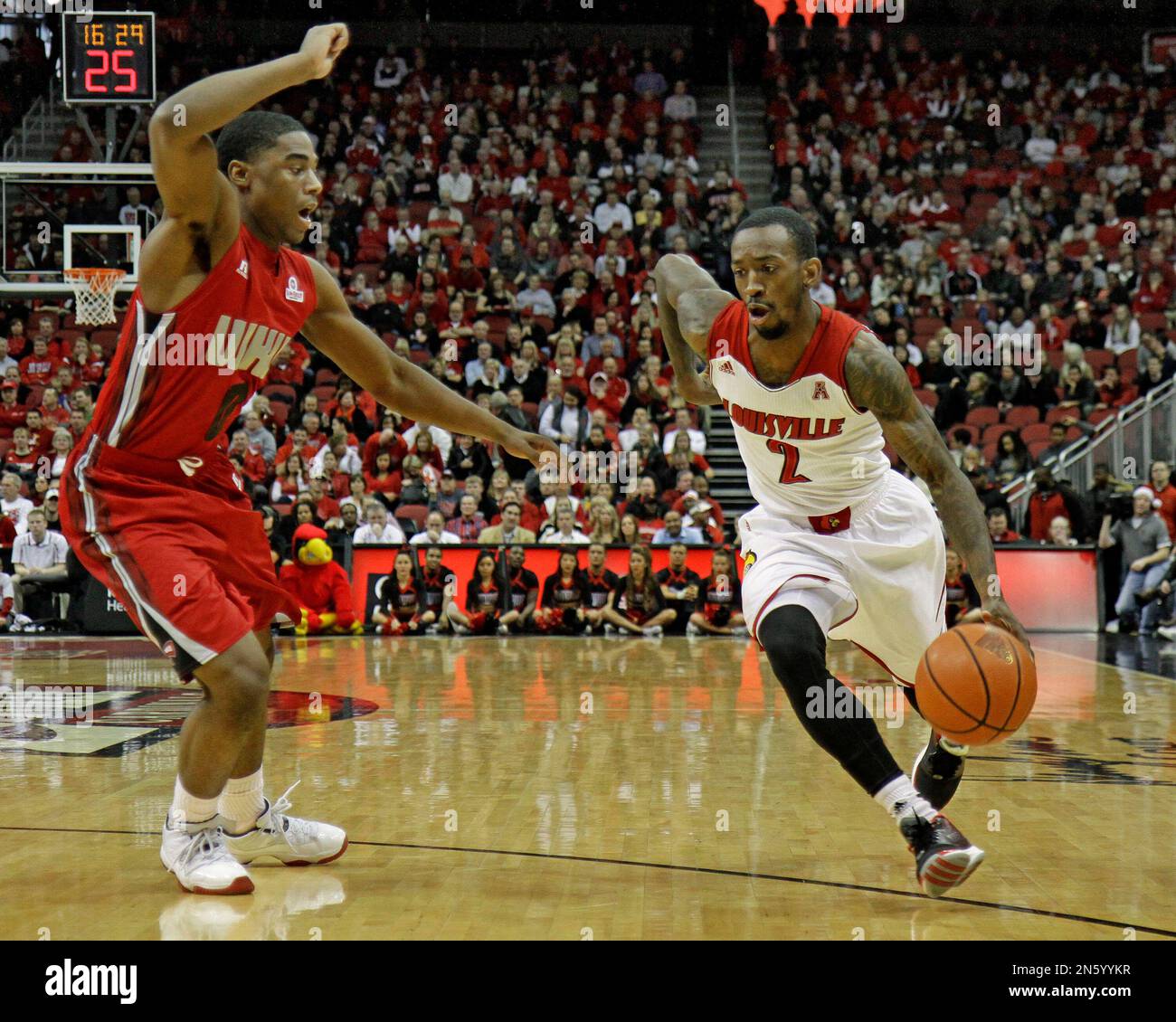 Louisville guard Russ Smith (2) drives past Western Kentucky's Payton ...