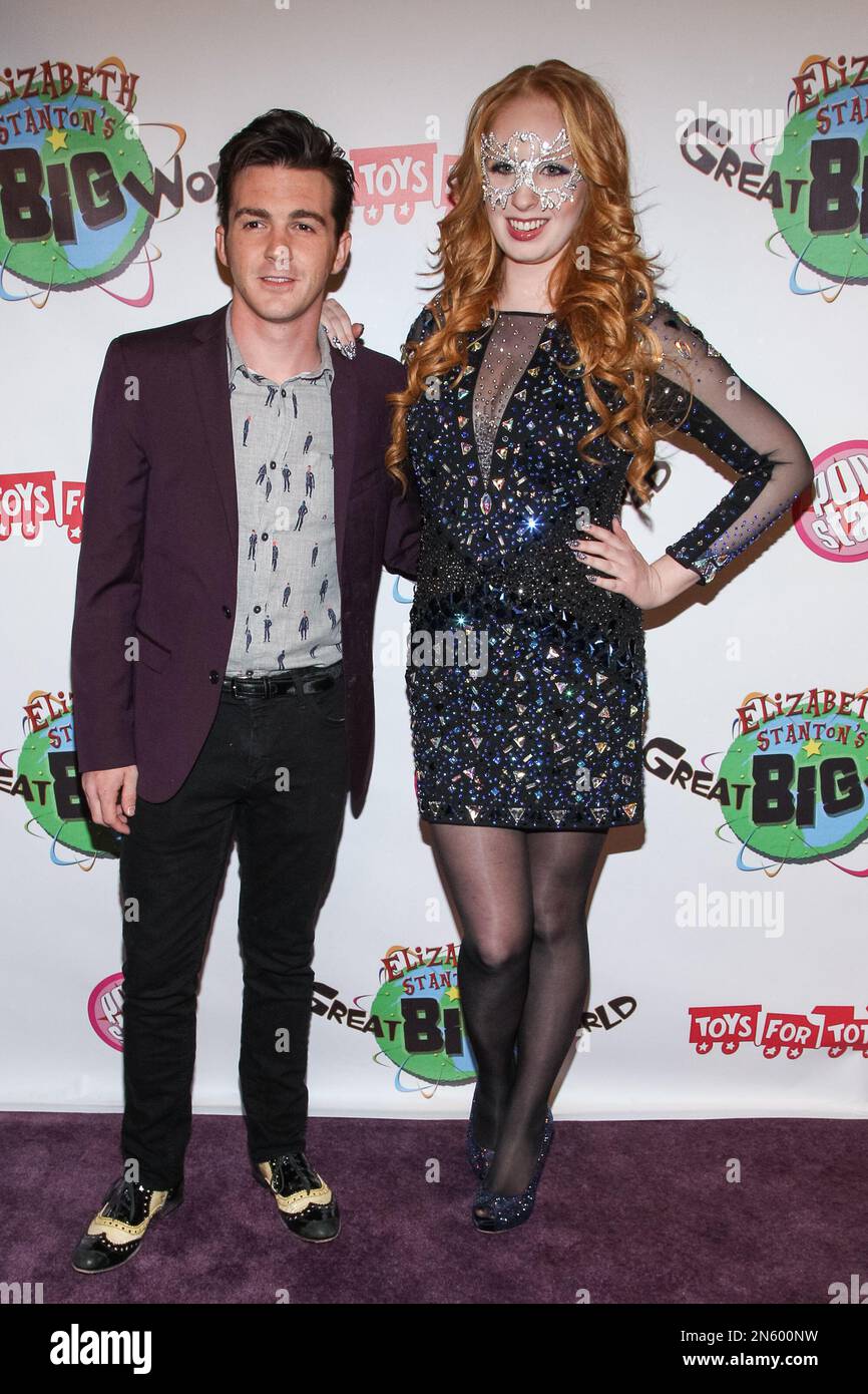 Actor/singer Drake Bell (L) and TV personality Elizabeth Stanton arrive ...