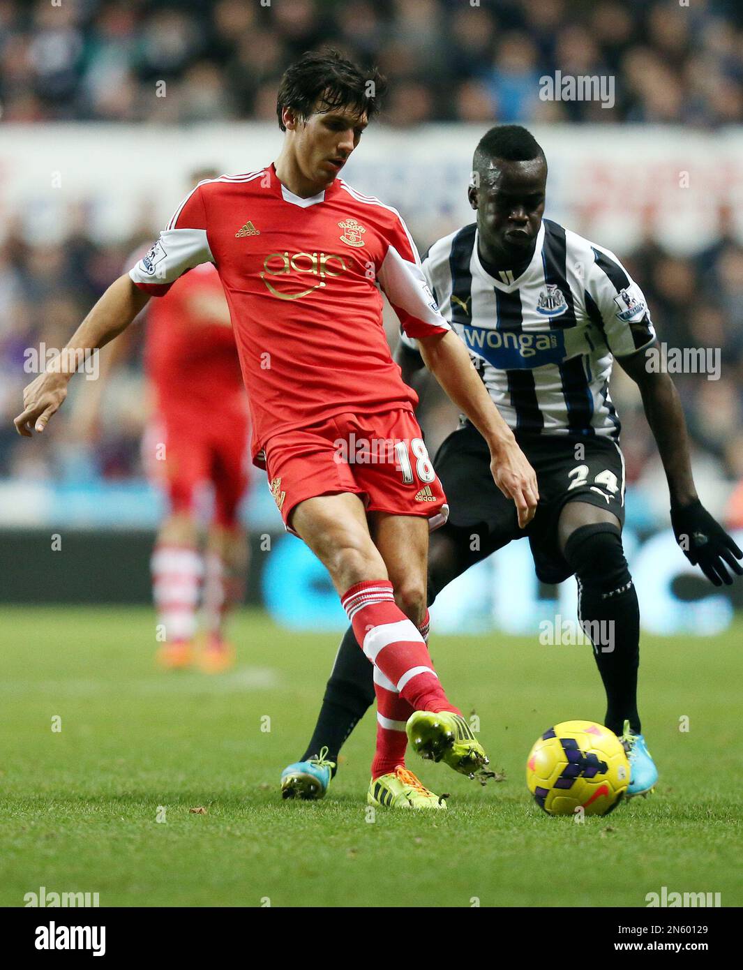 Southampton's Jack Cork, left, vies for the ball with Newcastle United ...
