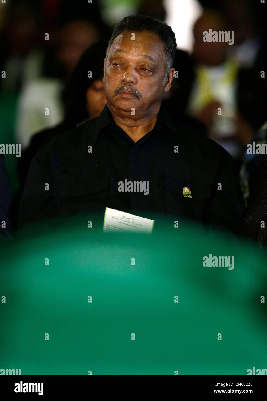 US civil rights leader Jesse Jackson sits in front of former South ...